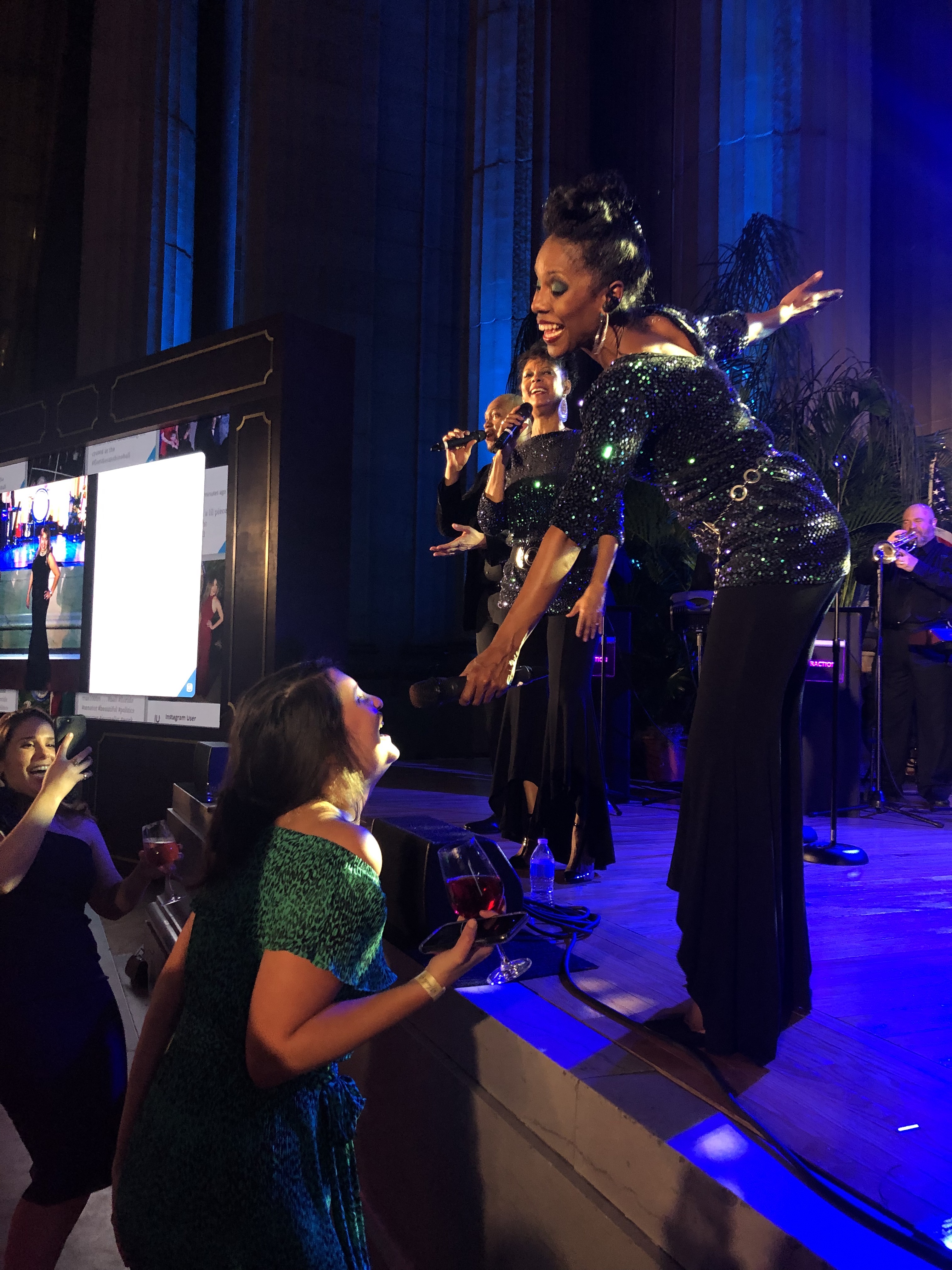 A partygoer sings a few lines | The Capitolist